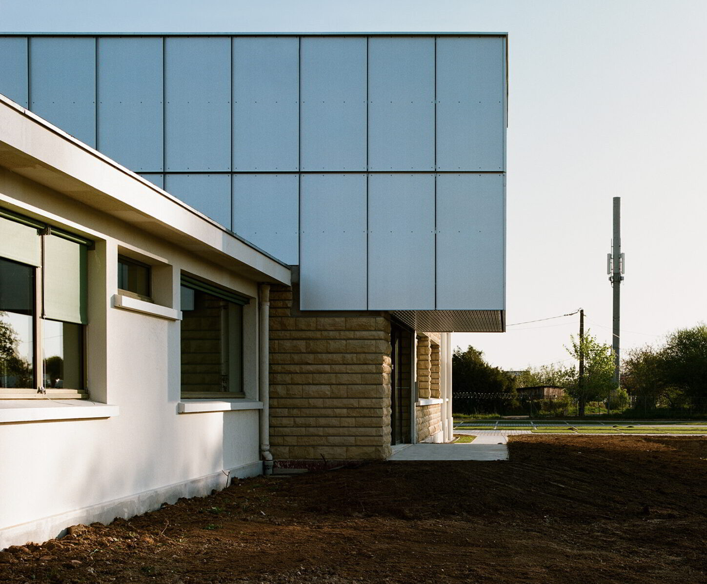 Igesa_Conversion of a former military clinic into secured offices | by ...