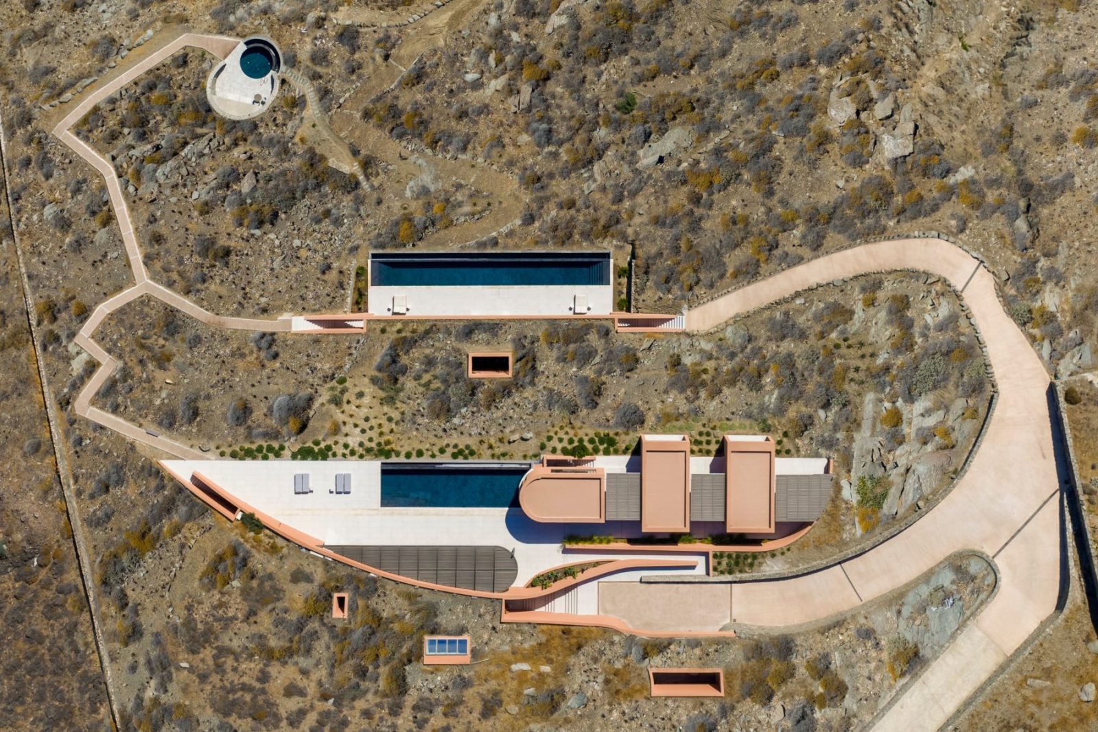 Olen in Syros by Ateno is an earth-sheltered retreat in three acts