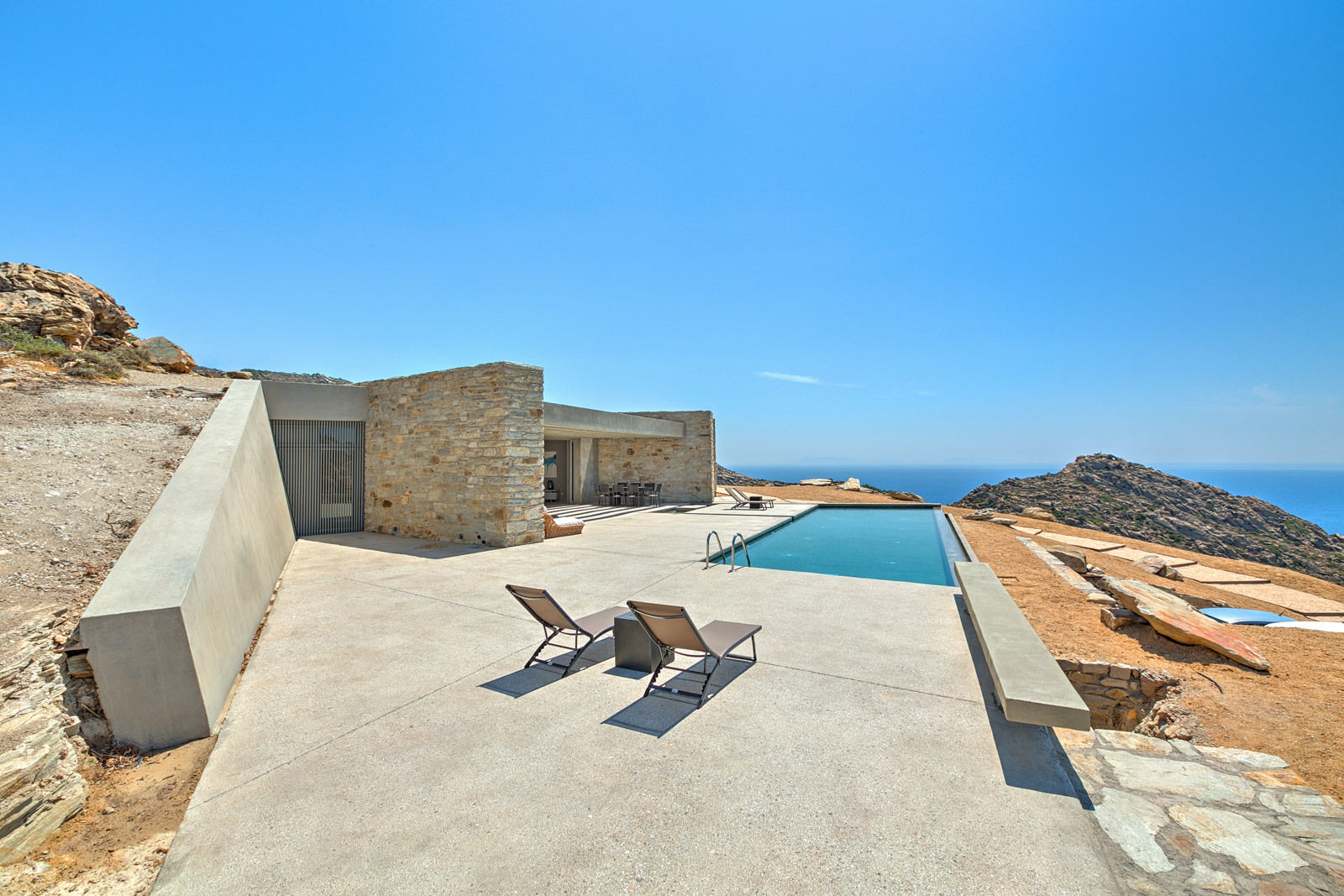 An Undercut Residence in Ios Overlooking the Aegean Sea / Christos ...